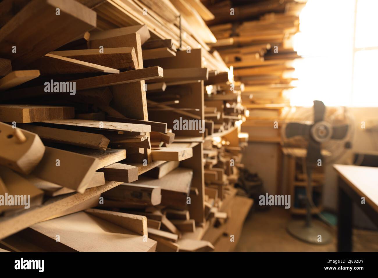Interior of workshop with stack of wood on rack, copy space Stock Photo ...
