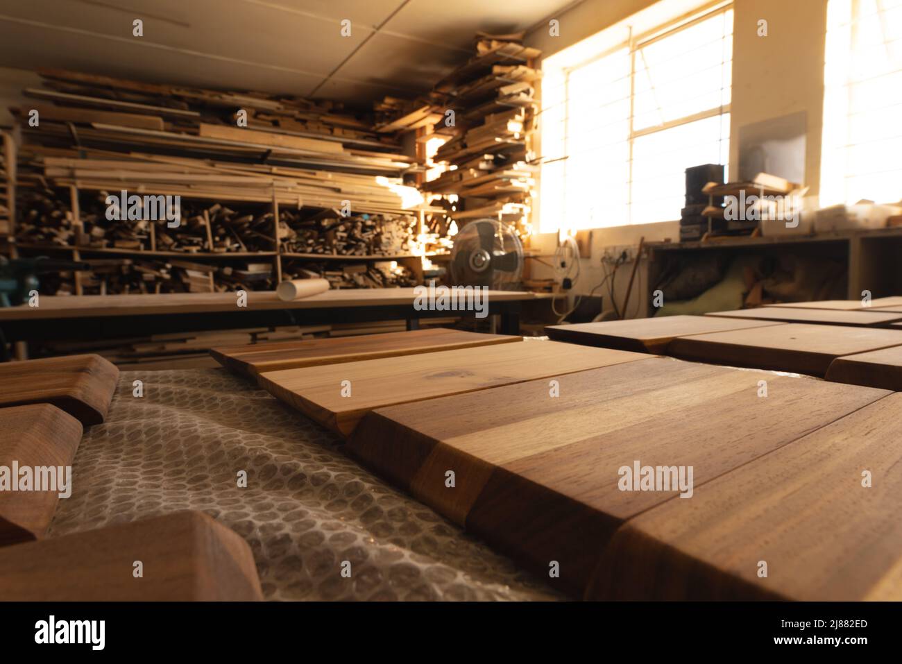 Interior of workshop with arranged wood, copy space Stock Photo - Alamy