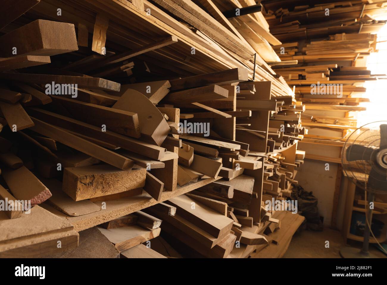 Interior of workshop with stack of wood on rack, copy space Stock Photo ...