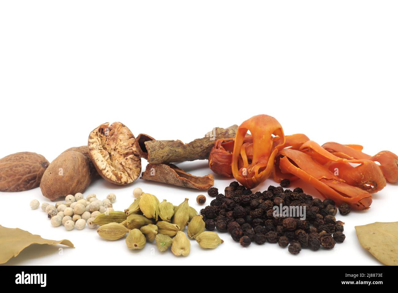 Different mix of aromatic spices isolated in white background ...