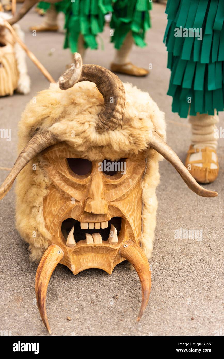 Handmade mask on the ground at Kukeri mystical traditional millennium ...