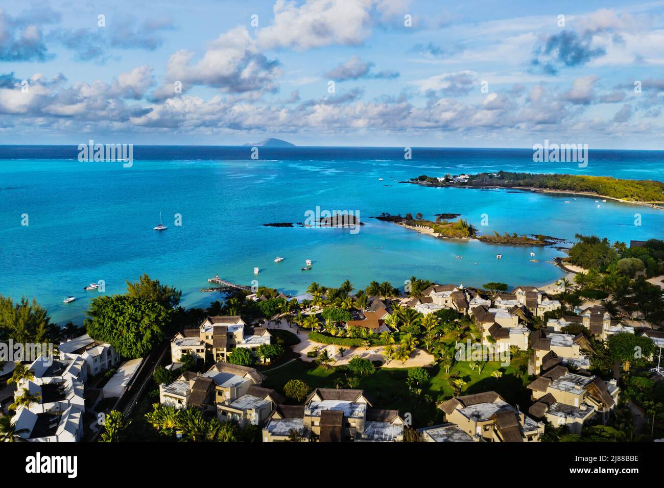 Aerial photography of a coral reef and a hotel complex with beaches in ...