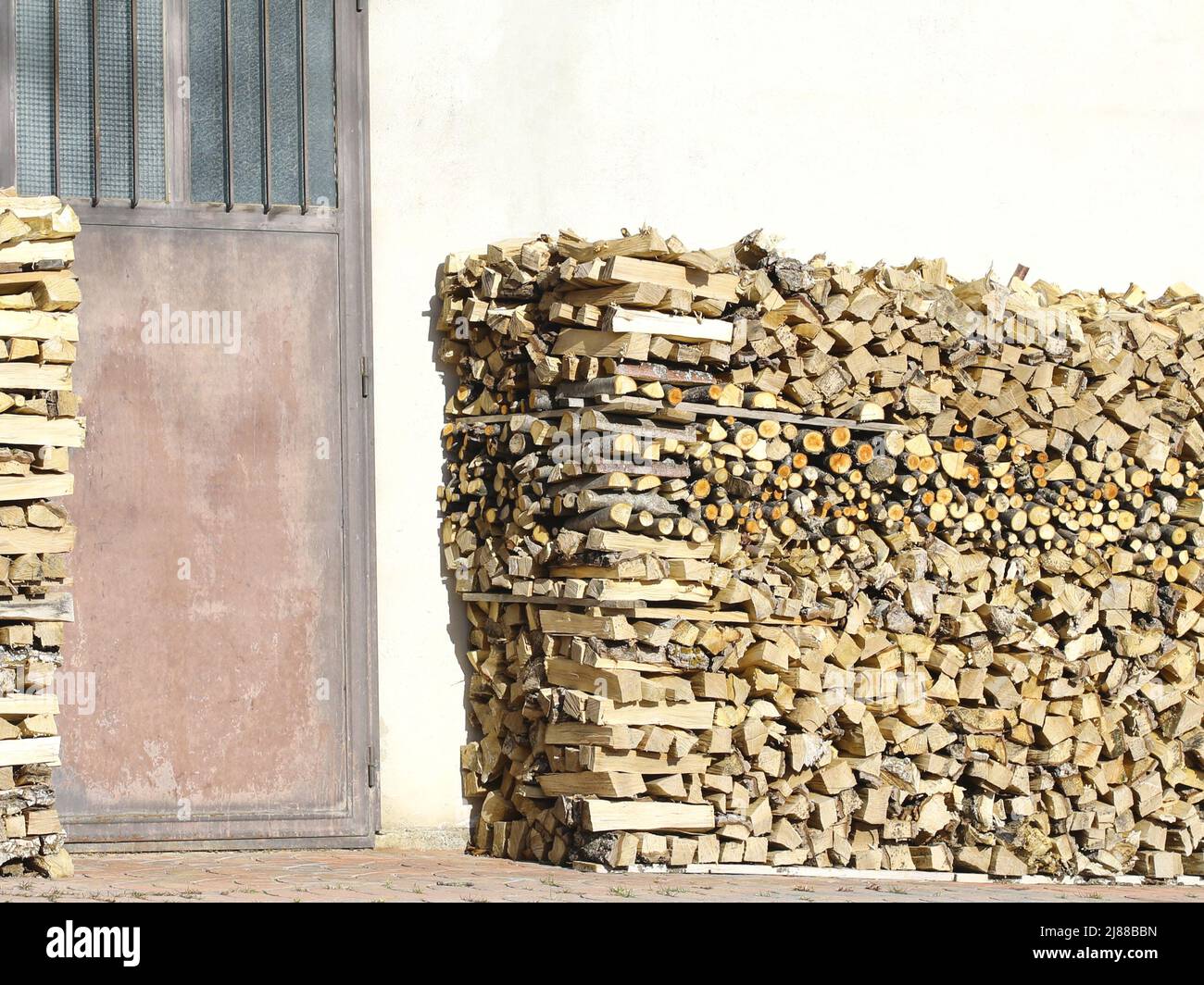 large woodshed of a mountain house that uses natural heating of dry ...