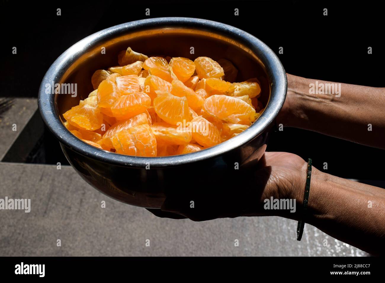 Slices of orange peeled completely and chopped and cut to make orange ...