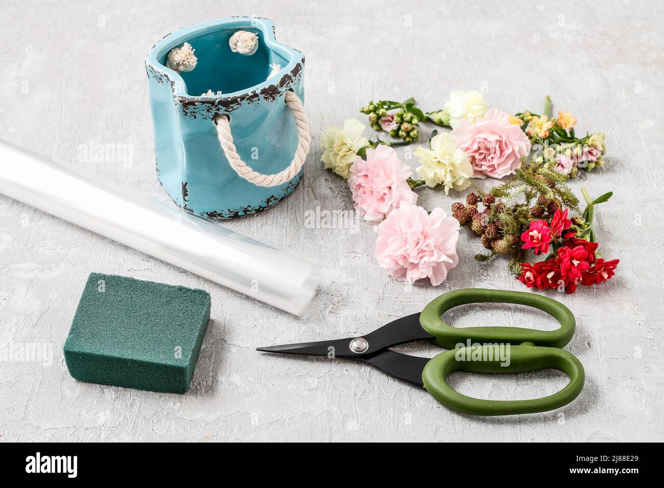 Florist at work: How to make bouquet of pink carnations and yellow ...