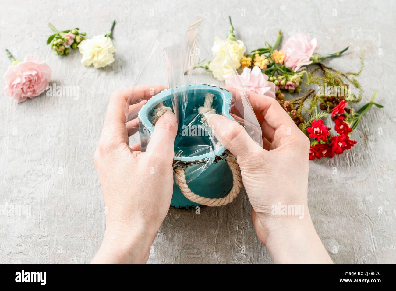 Florist at work: How to make bouquet of pink carnations and yellow ...