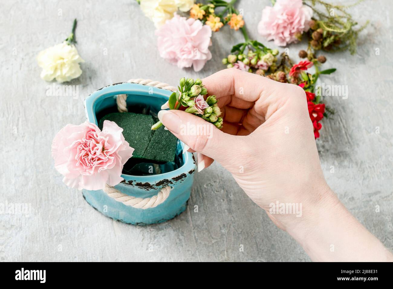 Florist at work: How to make bouquet of pink carnations and yellow ...