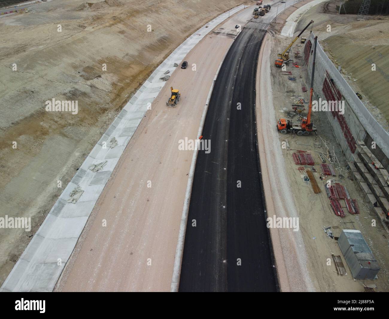 Road construction in progress on slope nature canyon. Infrastructure ...