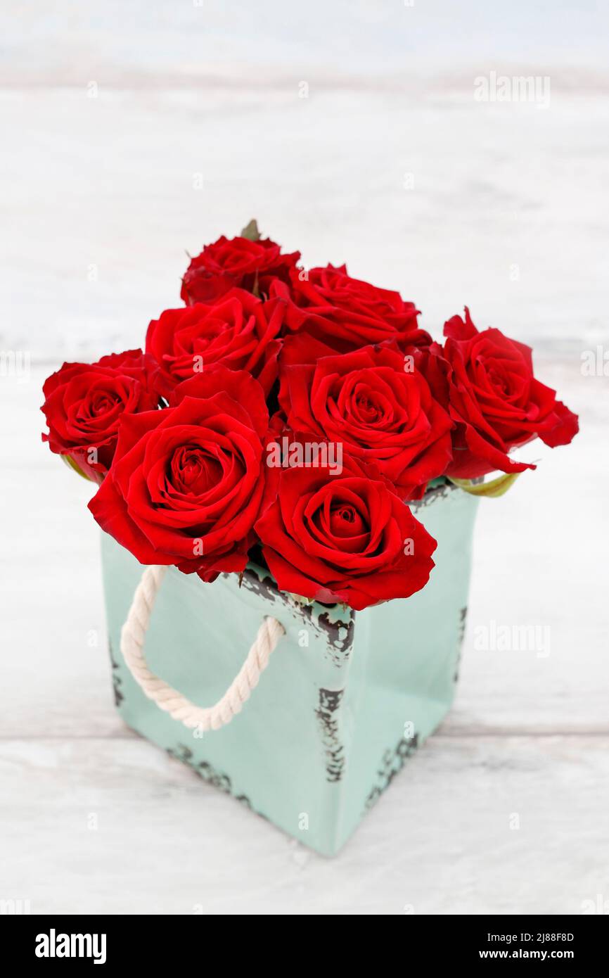 Red roses inside ceramic box. Party decor Stock Photo - Alamy