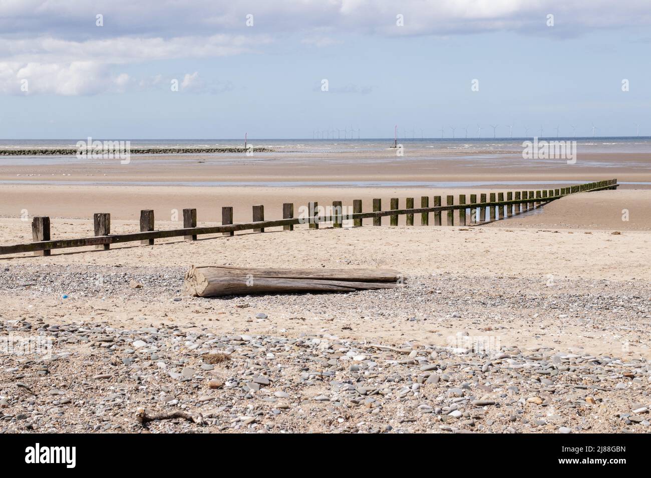 Rhyl North Wales, View out to sea, sand and stone, drift wood, groins ...