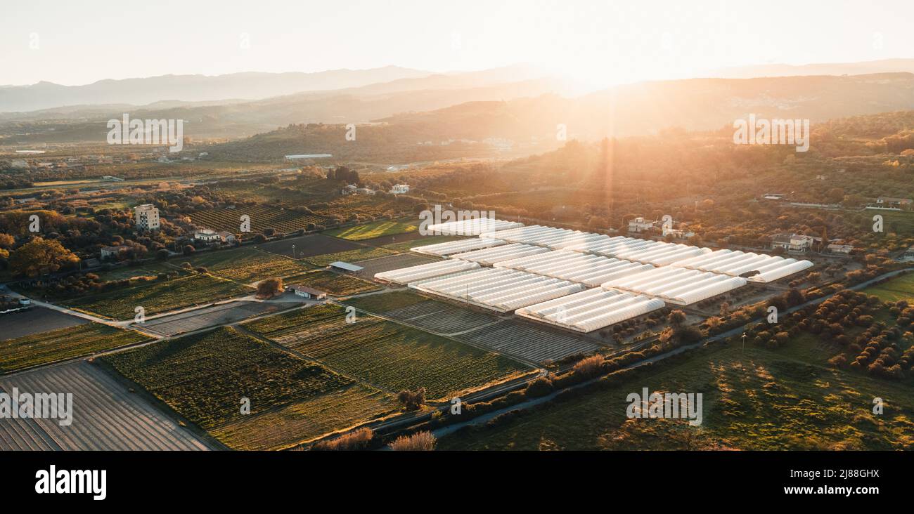 Greenhouse at sunset light. Aerial view Stock Photo - Alamy