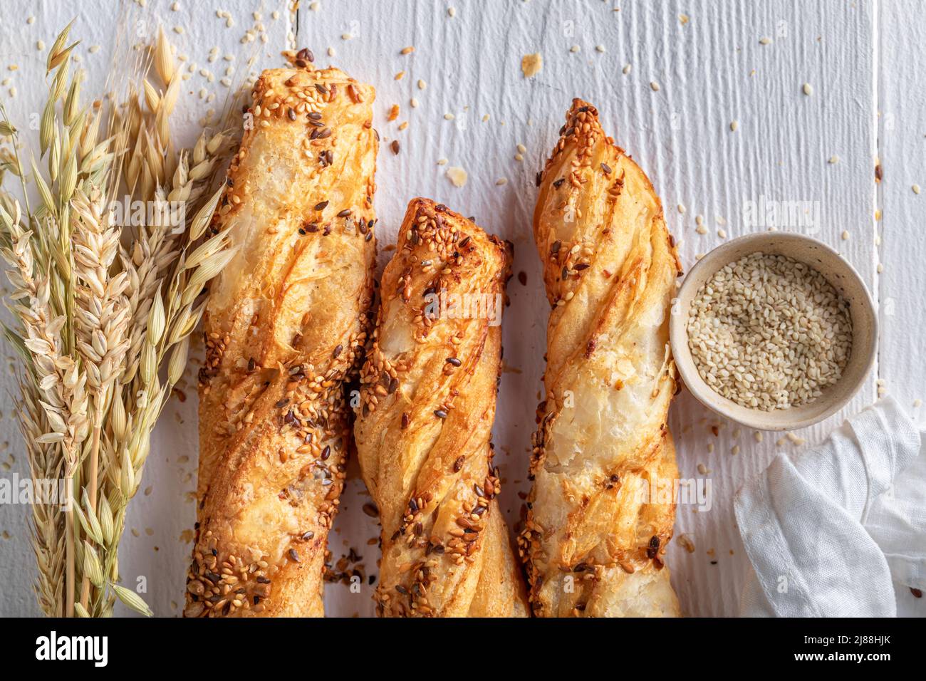 Fresh bread sticks baked in rustic kitchen. Grissini made in the bakery ...