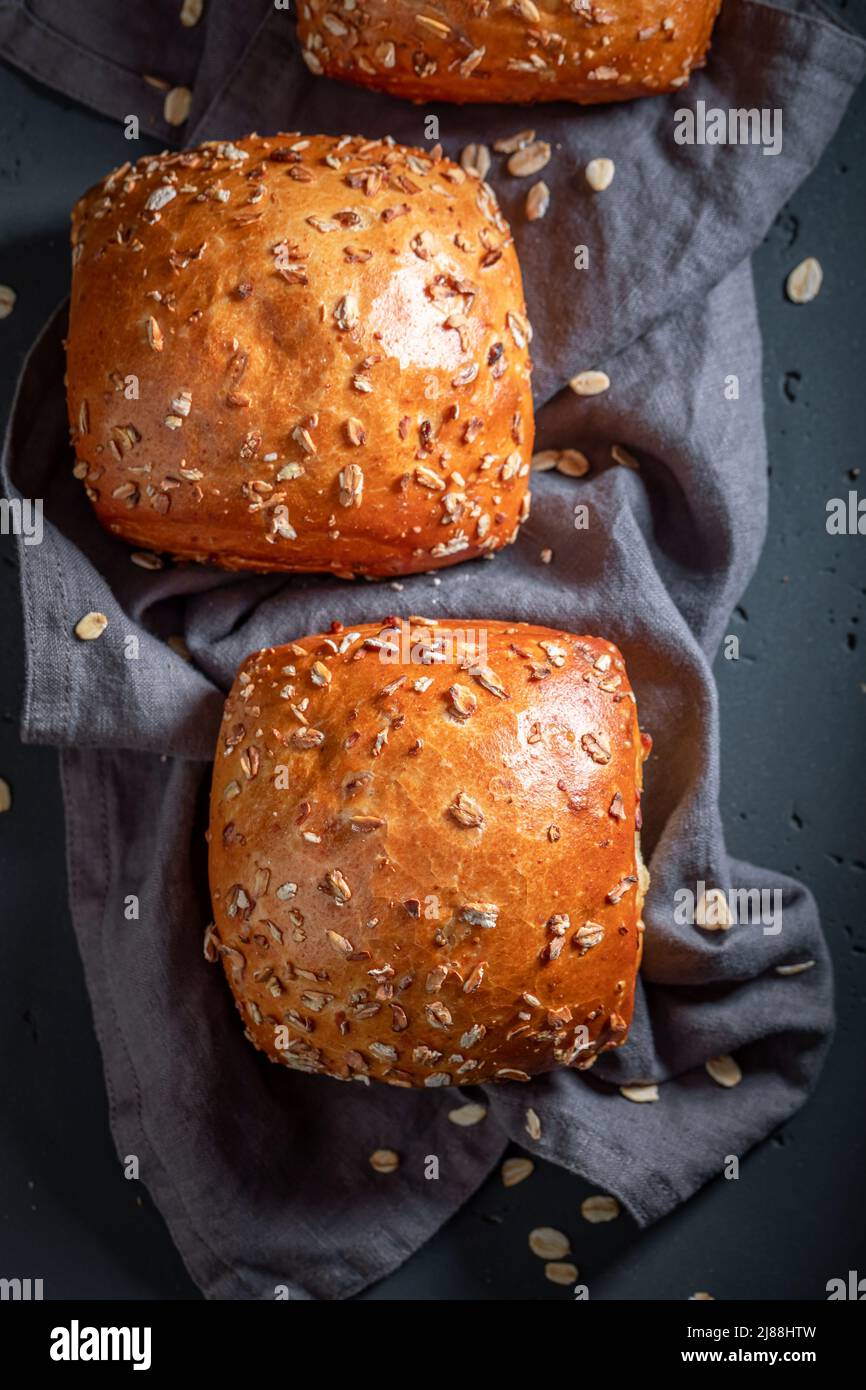 Rustic and healthy oat buns baked in home bakery. Buns of wheat and rye ...