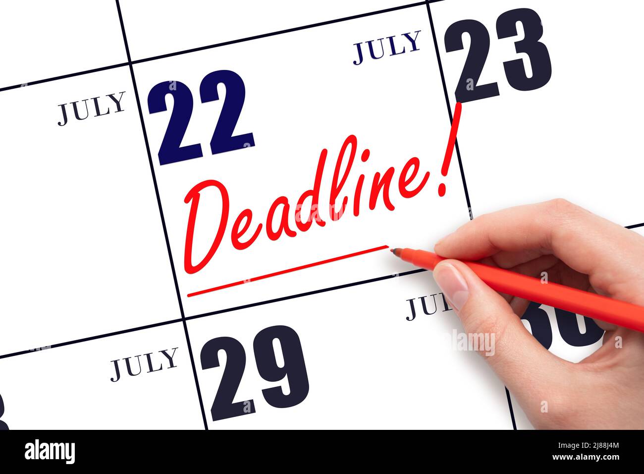 22nd day ofJuly. Hand drawing red line and writing the text Deadline on ...