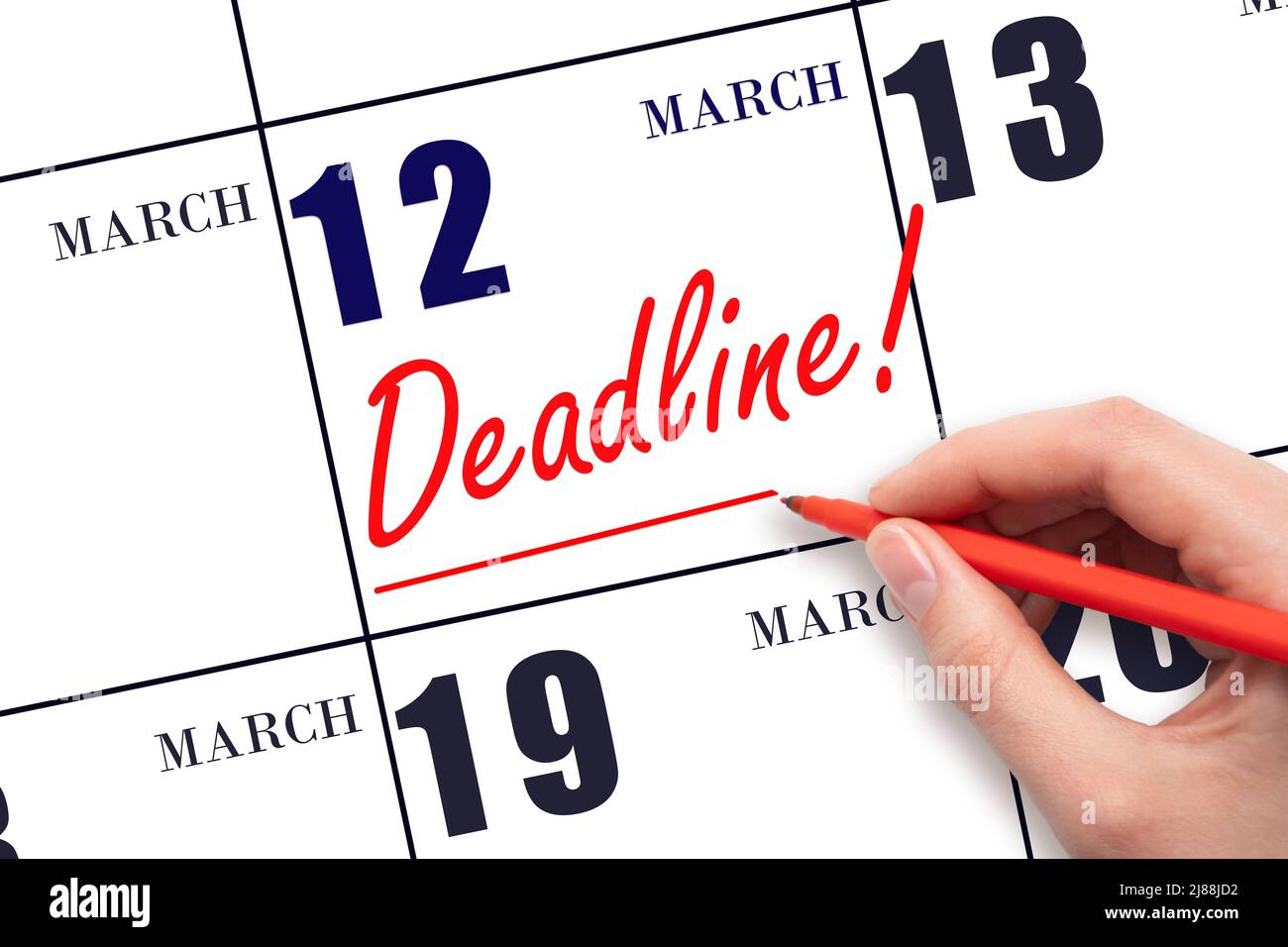 12th day of March. Hand drawing red line and writing the text Deadline ...