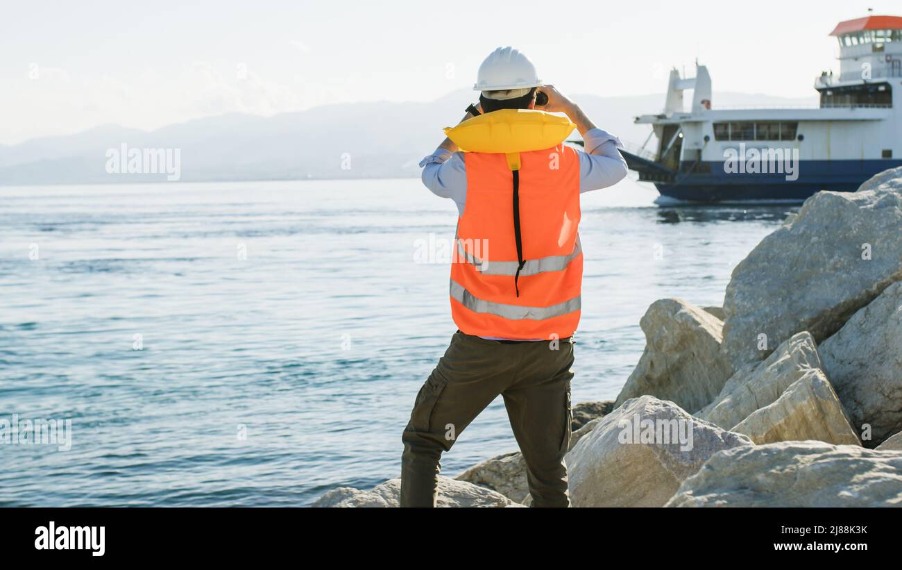 Engineer looking with high visibility jacket Stock Photo - Alamy