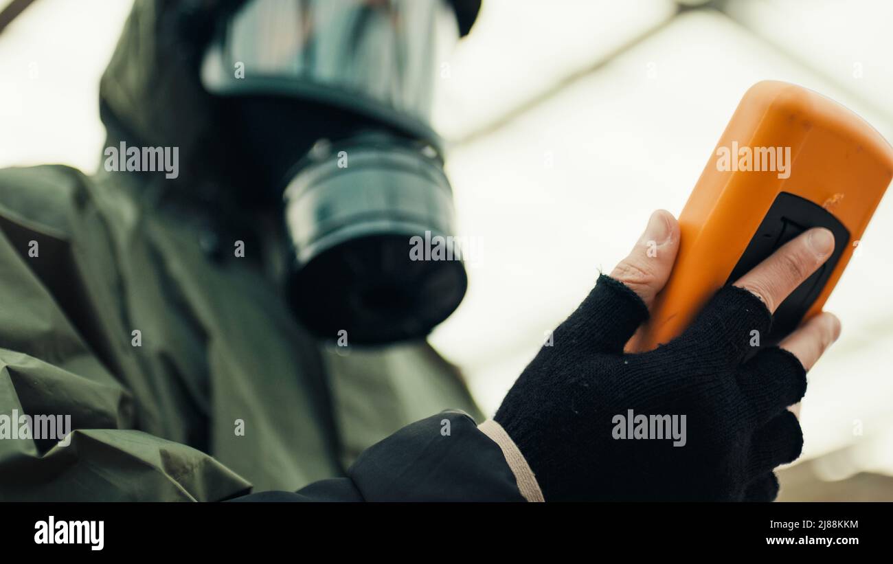 man with geiger counter in radioactive site Stock Photo - Alamy