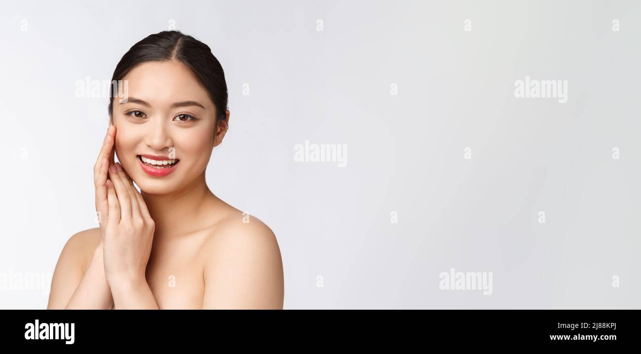 Beautiful asian woman makeup of cosmetic, girl hand touch cheek and ...