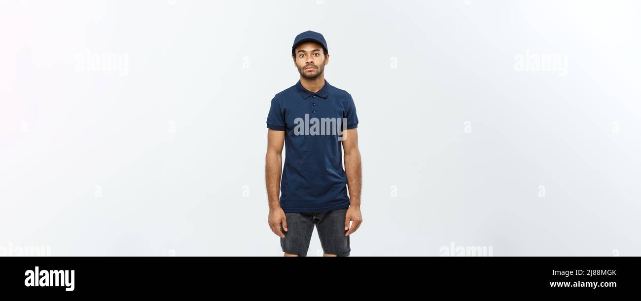 Delivery Concept - Handsome African American delivery man. Isolated on ...