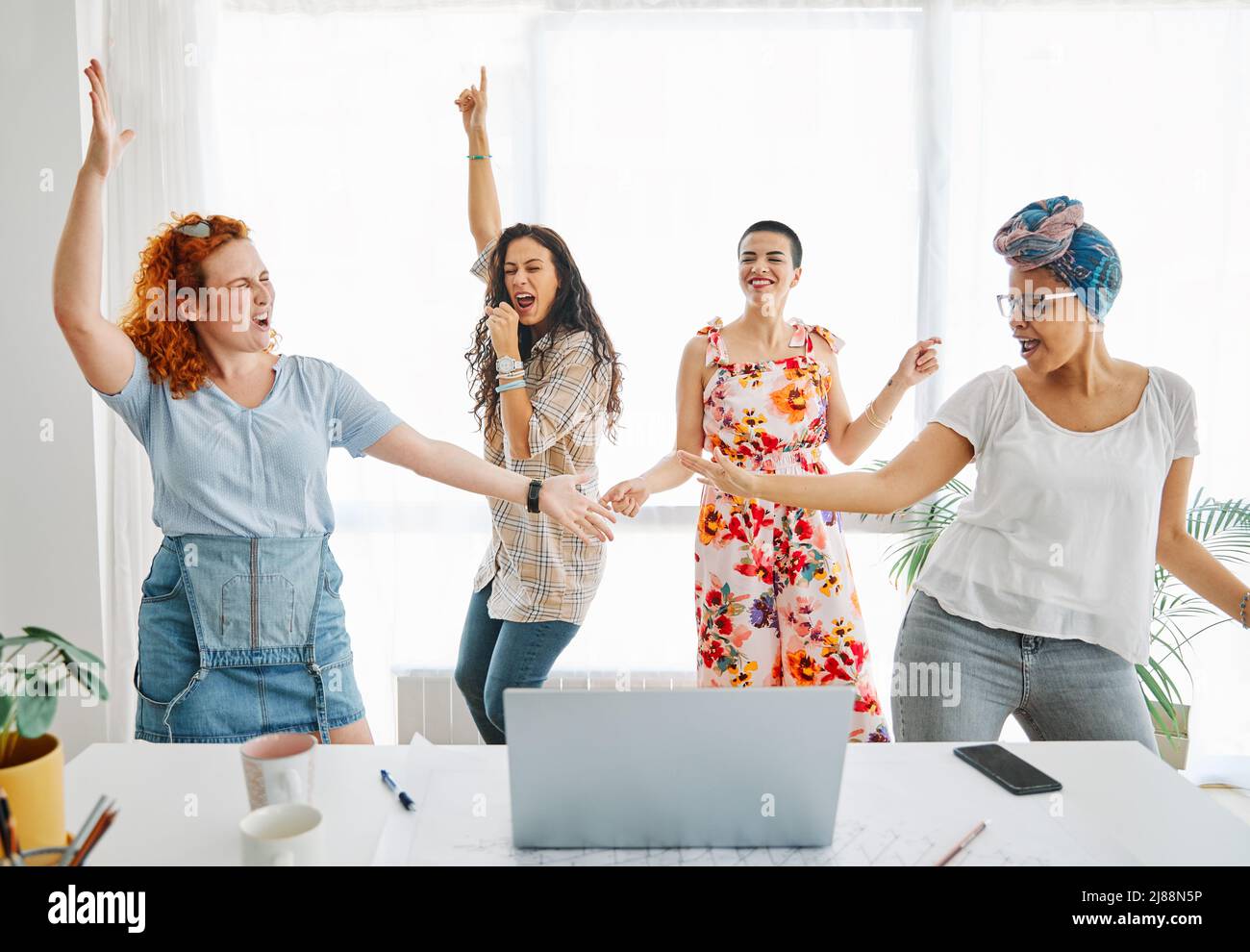 young woman business office student start up friend teamwork dancing ...