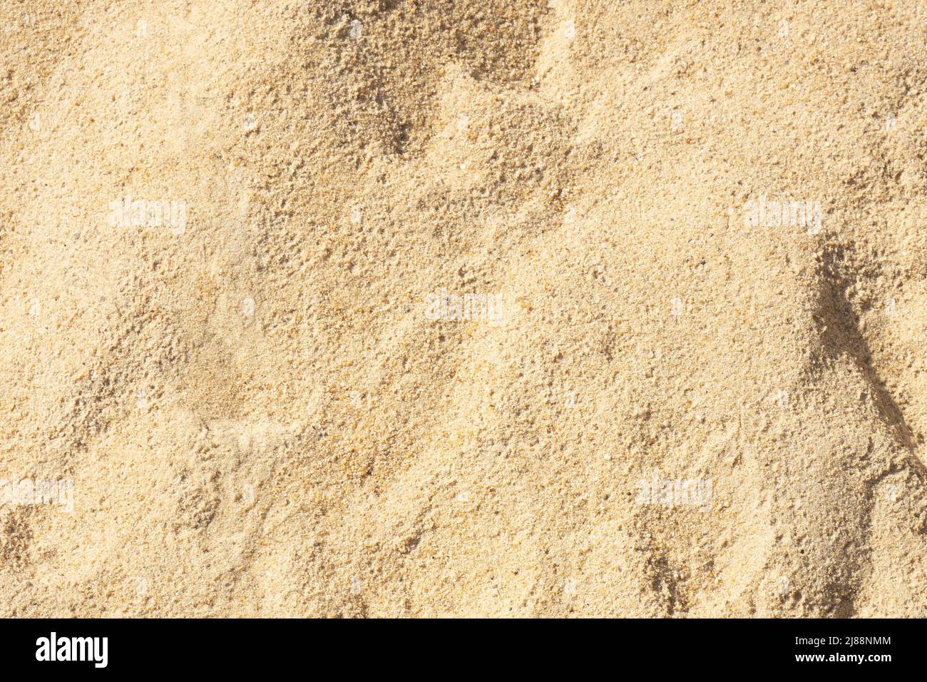 Background from sand under sun rays Stock Photo - Alamy