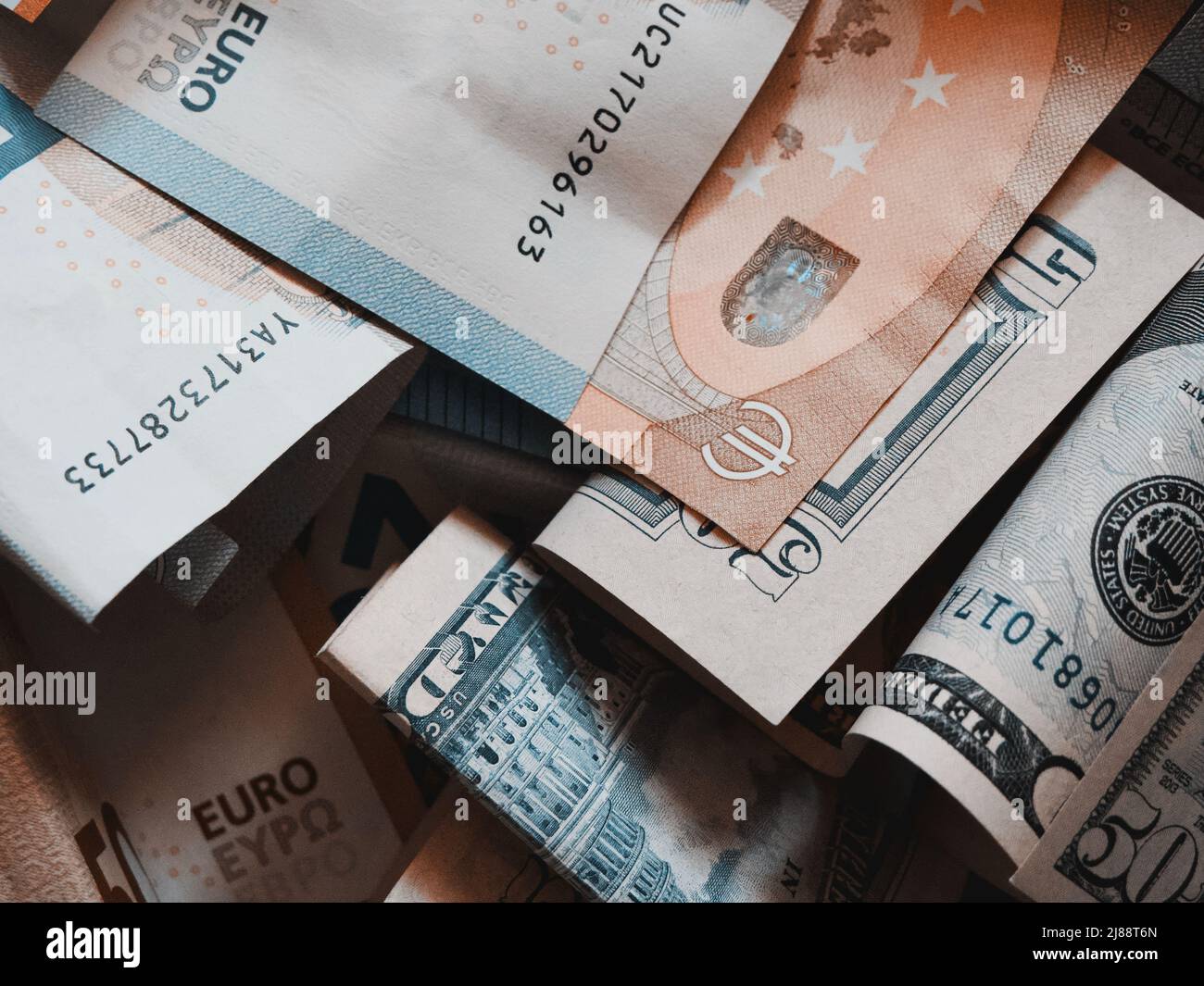 Cash banknotes dollars and euros are mixed up, a close-up shot Stock ...