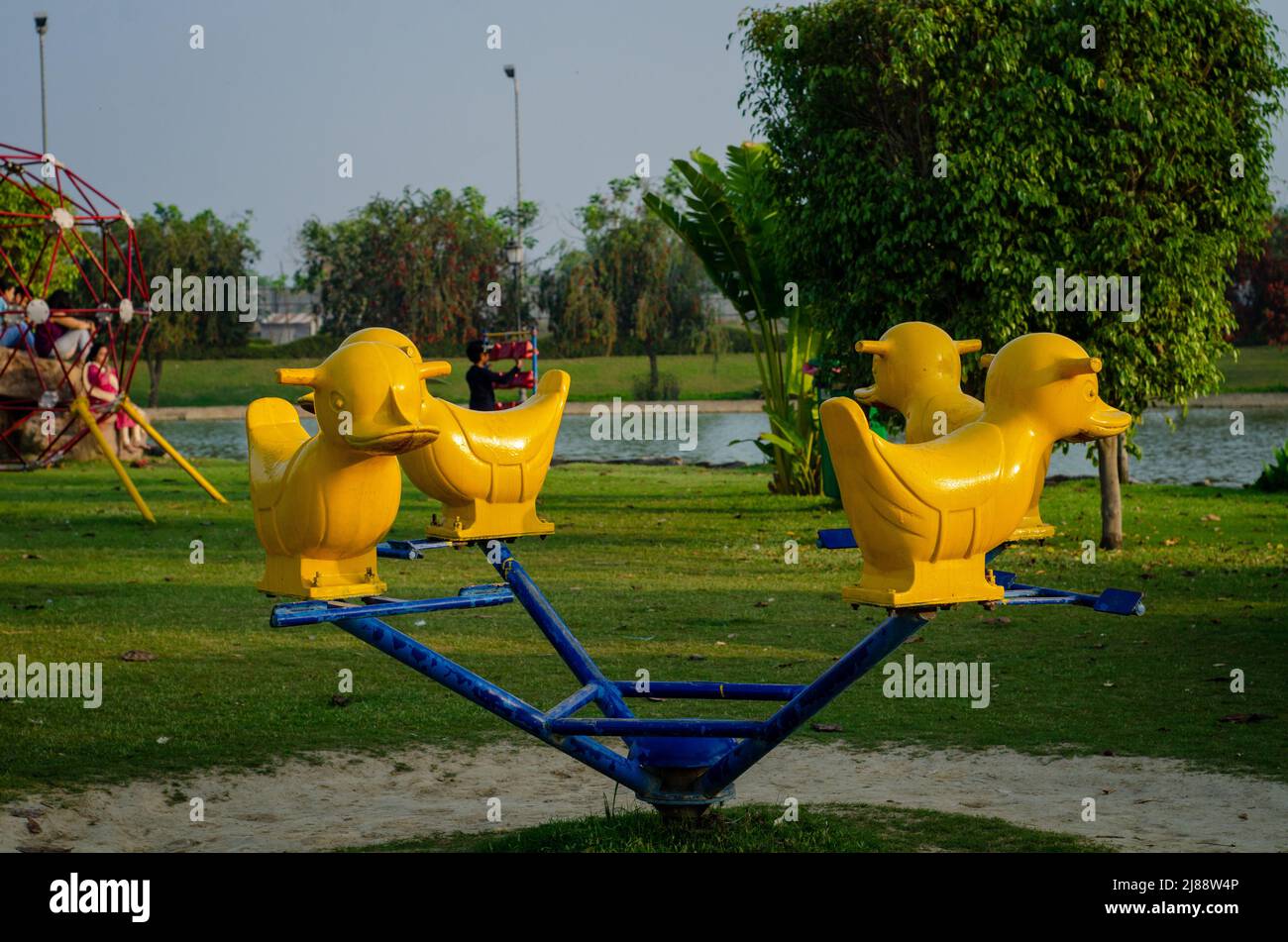 Fun ride for children in a park Stock Photo - Alamy