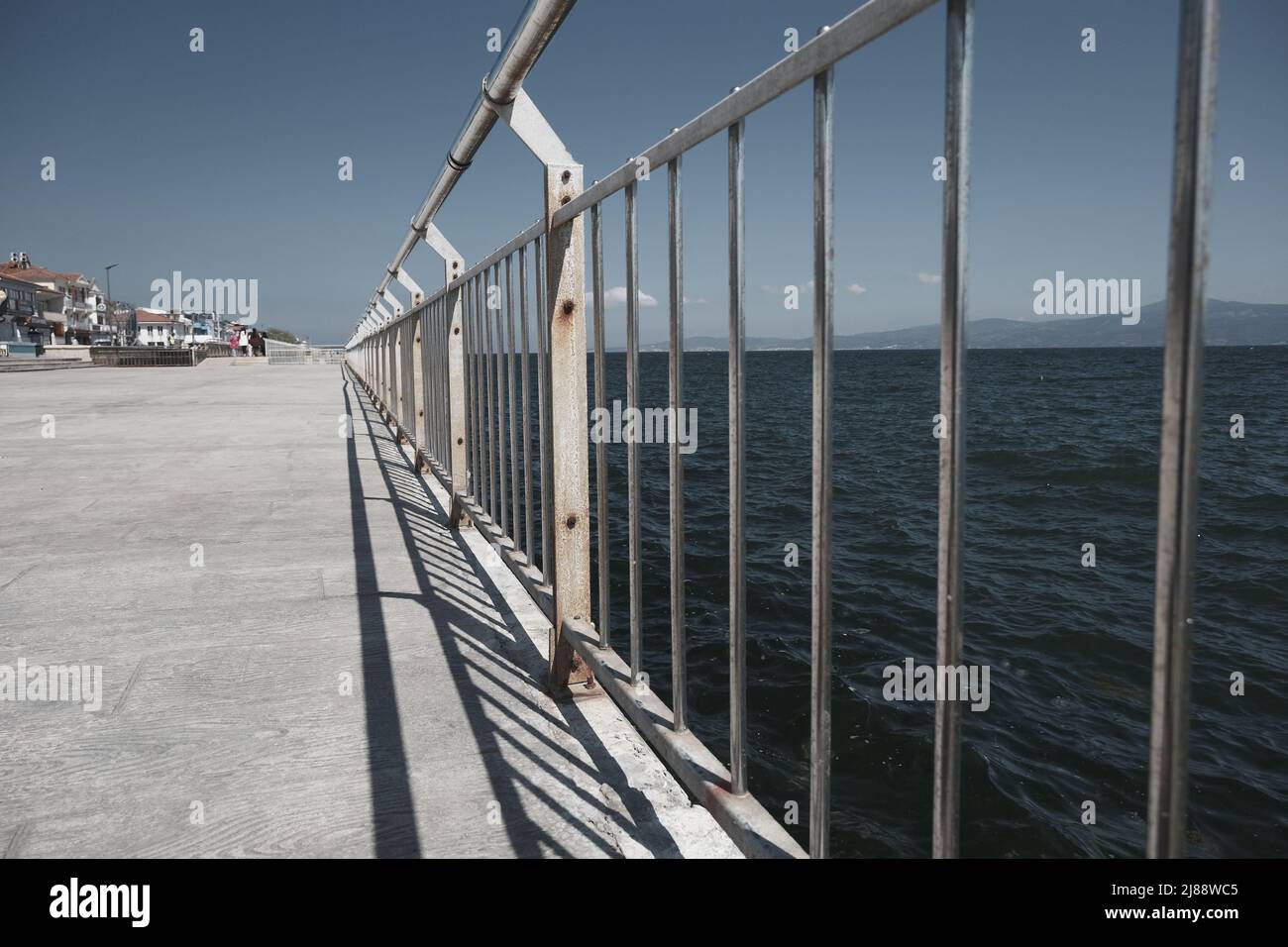 the pier on the beach, rail and rusty with sea background, sea of ...