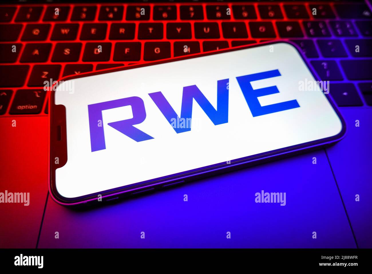 In this photo illustration, an RWE logo is displayed on the screen of a ...