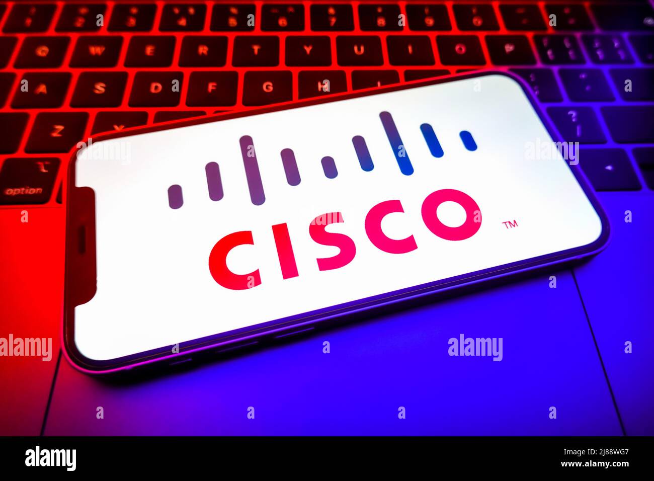 In this photo illustration, a Cisco logo is displayed on the screen of ...