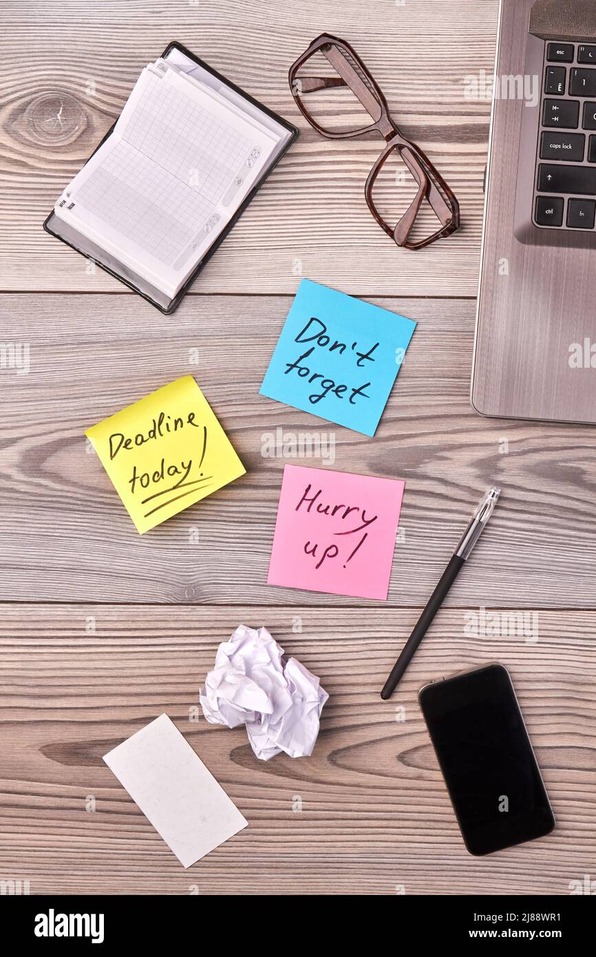 Sticky notes with motivation text and work office accessories. Vertical ...