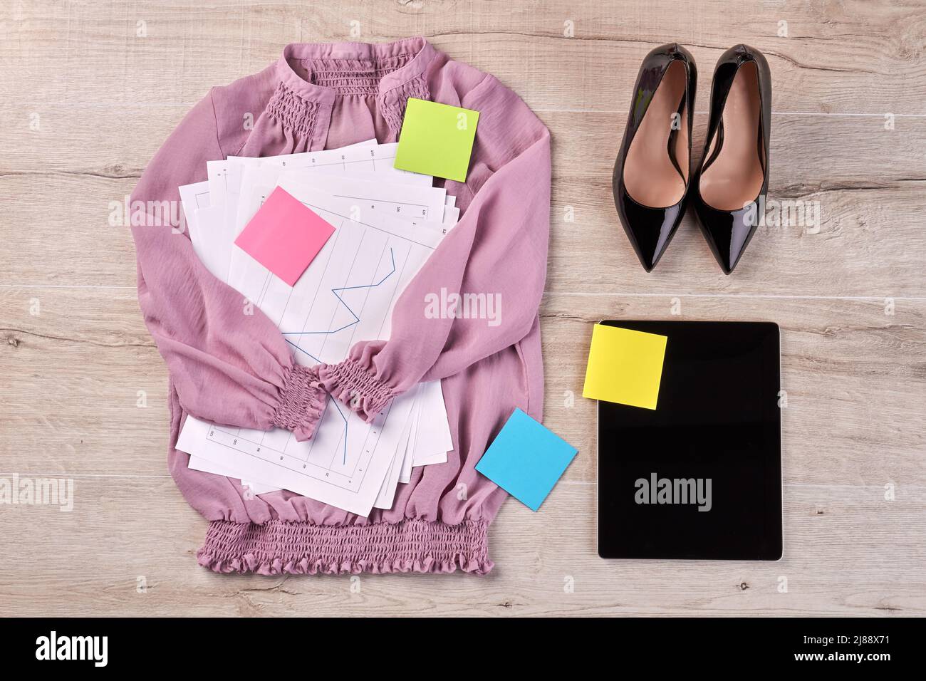 Purple blouse with work papers and black shoes. Top view flat lay Stock ...