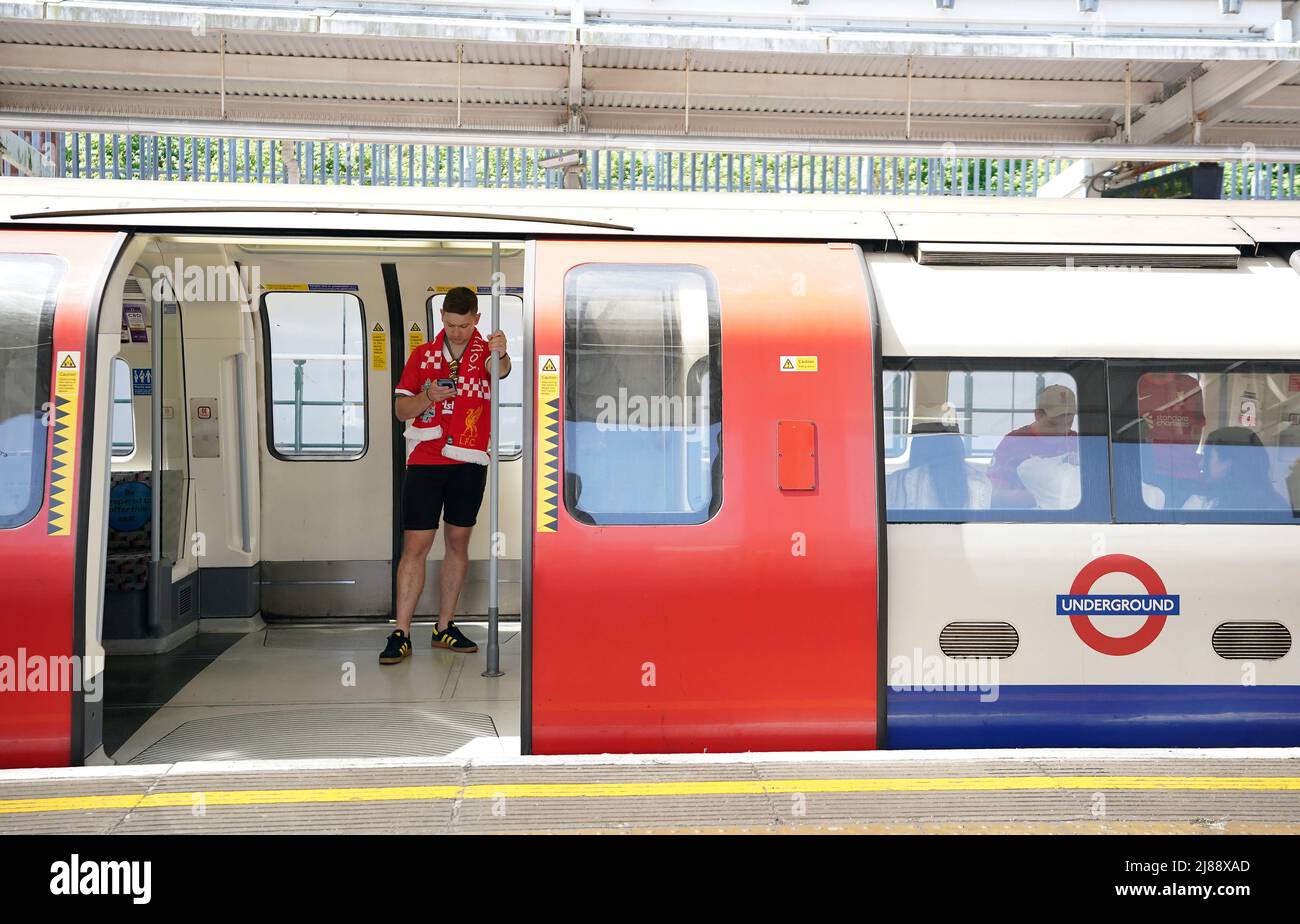 A Liverpool fan takes the London Underground tube to the stadium ahead ...