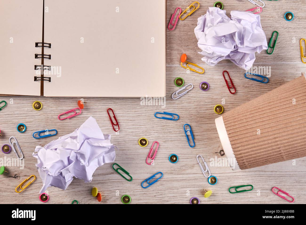Top view wrap papers with blank notepad and paper clips. White desk ...
