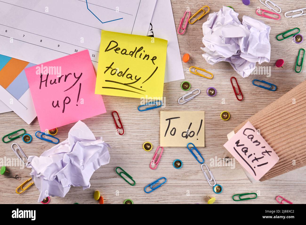 Sticky notes with paper clips and statistic diagrams. Top view flat lay ...