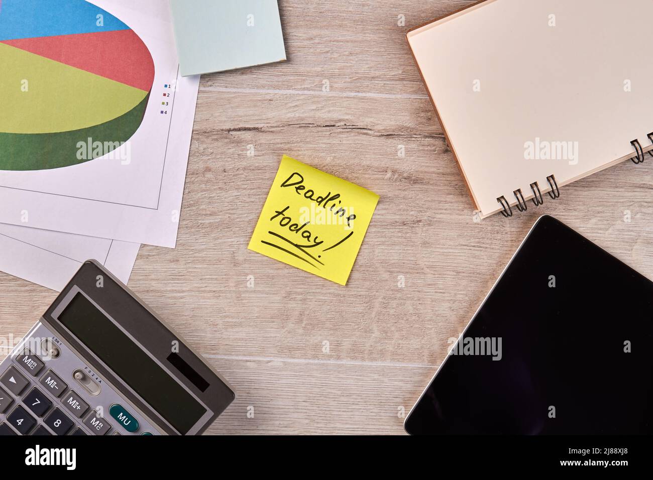 Deadline today concept. Diagram with calculator and notepad. Top view ...