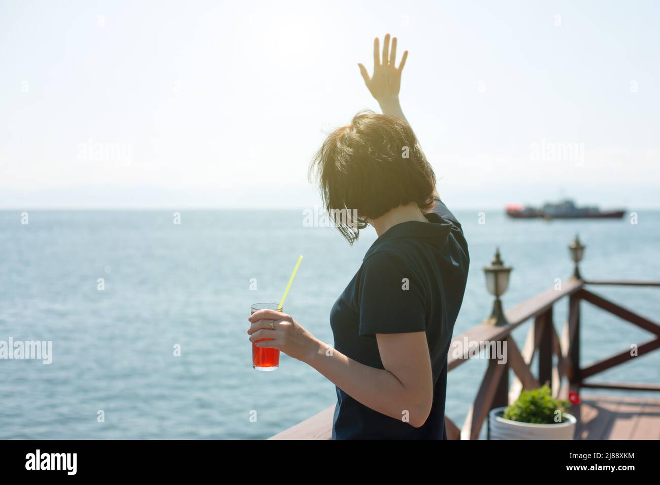 Woman waving ship hi-res stock photography and images - Alamy