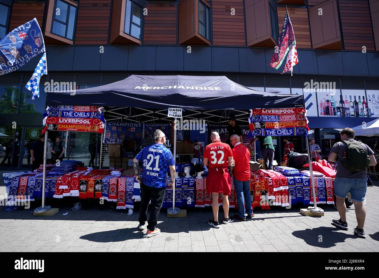 Chelsea and Liverpool fans view a merchandise stand ahead of the ...