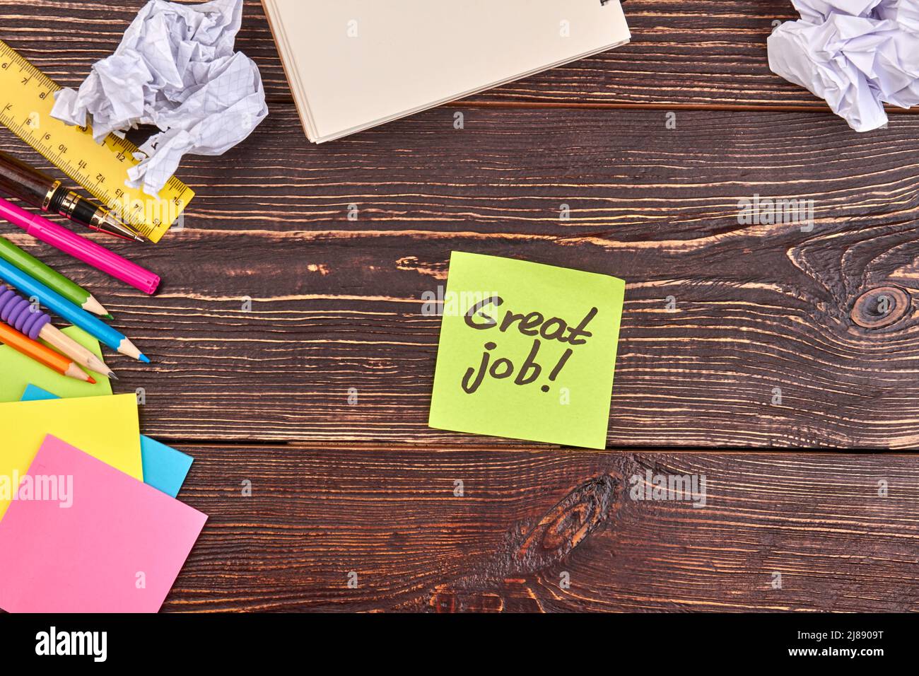 Great job handwriting and stationery accessories. Brown wooden desk ...