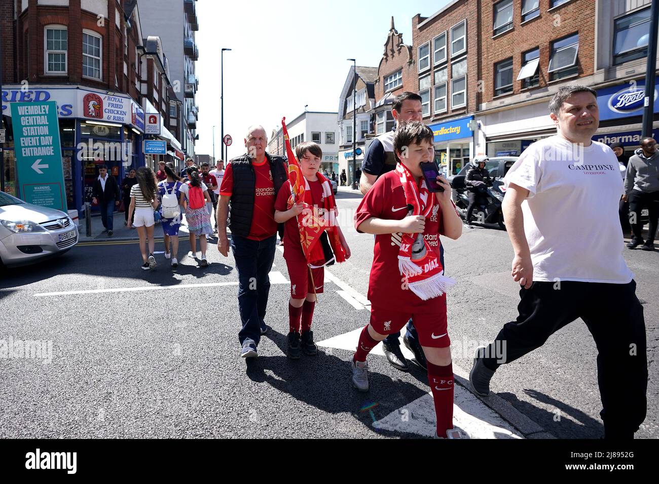 Liverpool fans make their way to the stadium ahead of the Emirates FA ...