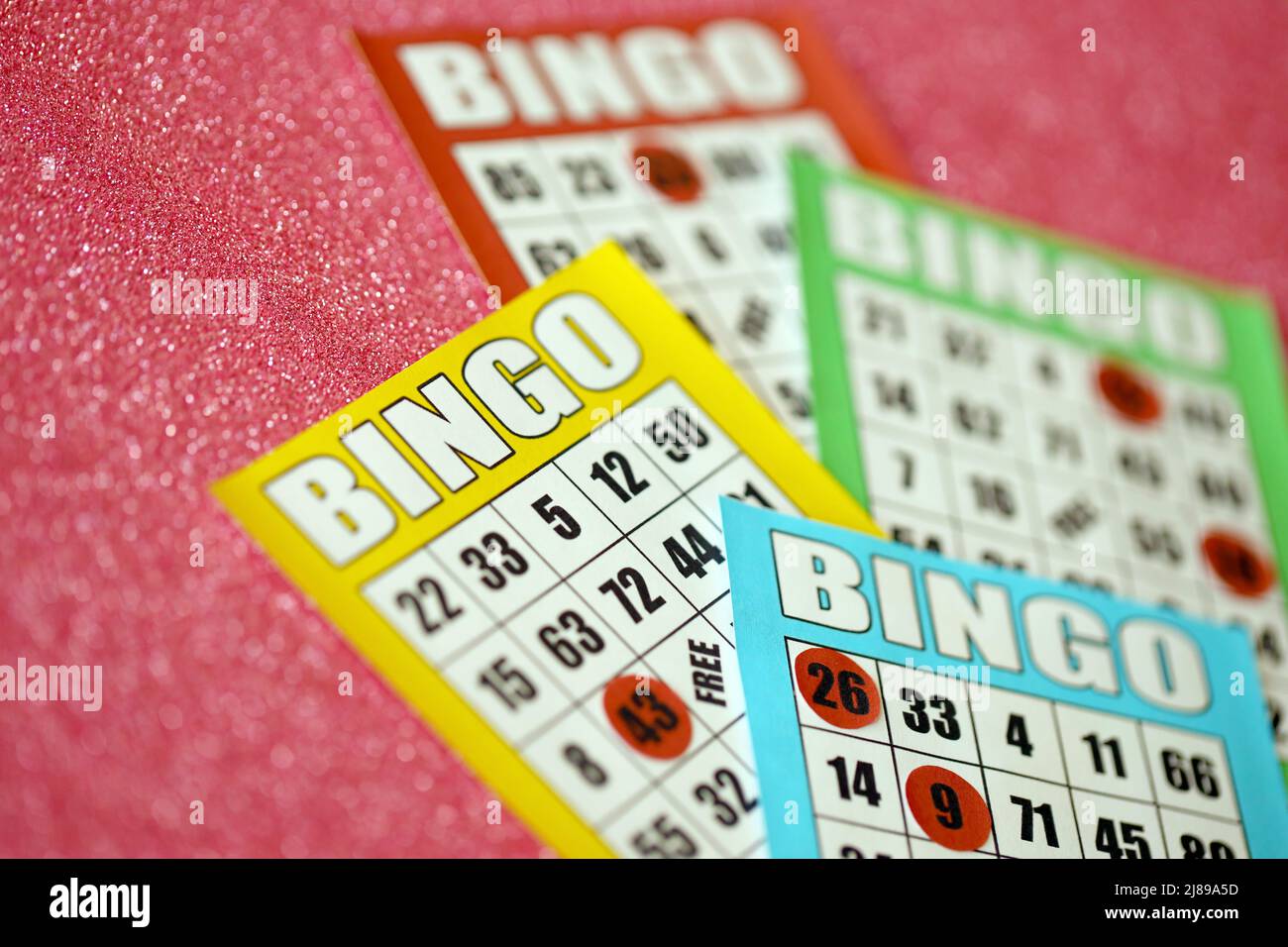 Many colorful bingo boards or playing cards for winning chips. Classic ...