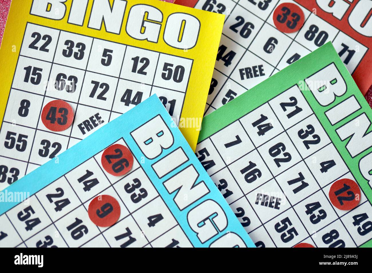 Many colorful bingo boards or playing cards for winning chips. Classic ...