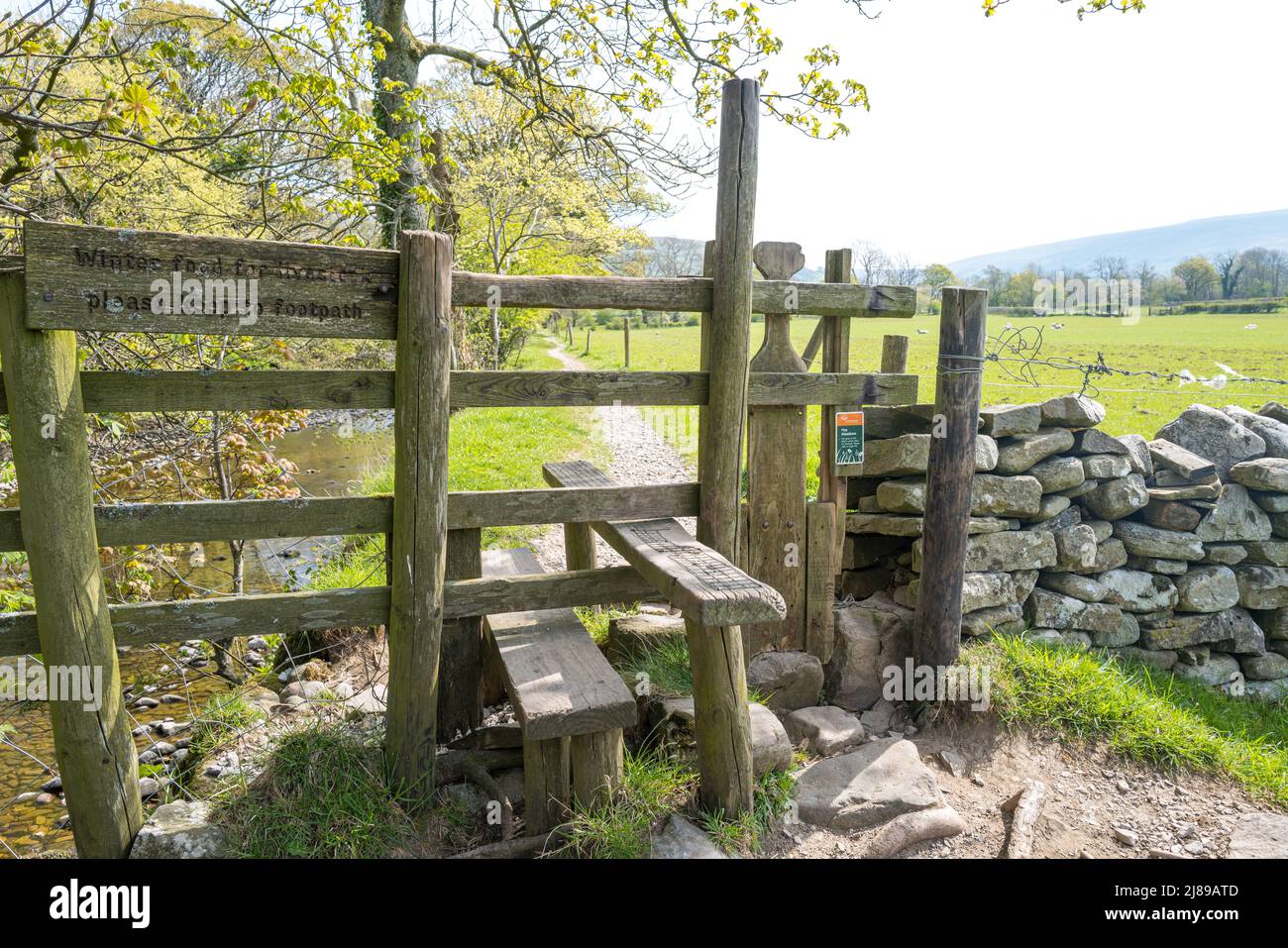 Traditional country stile with wooden dog gate Stock Photo - Alamy
