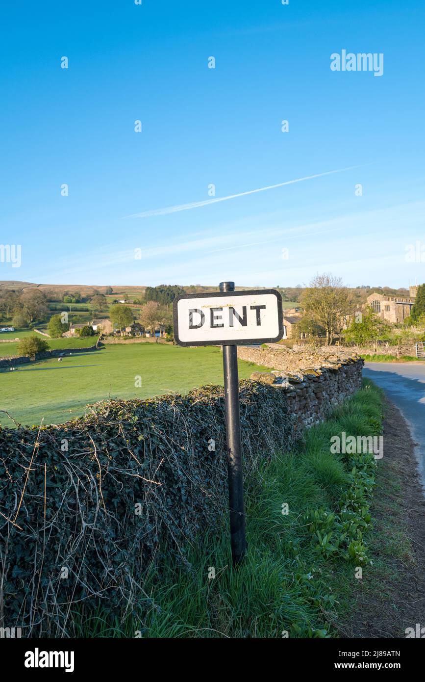 The Dent village sign with old church in the background Stock Photo - Alamy