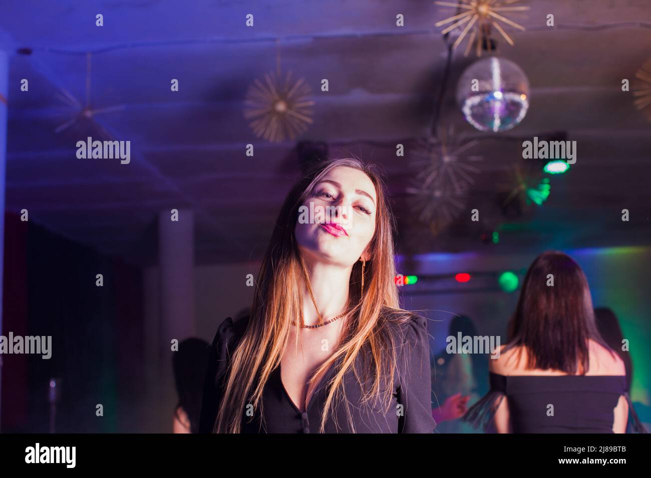 Cheerful female teens nightclub hi-res stock photography and images - Alamy