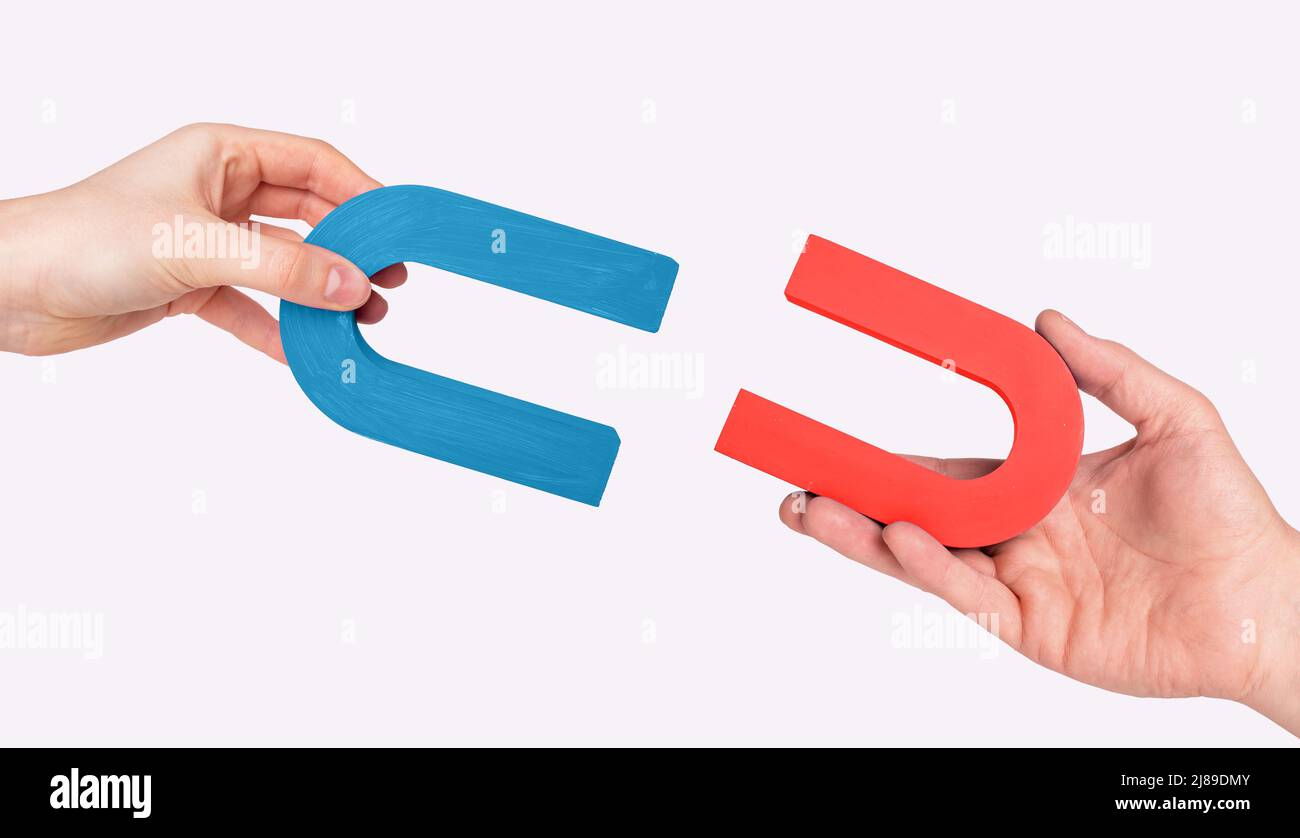 Match, partnership, ideal collaboration concept. Two hands with magnets ...
