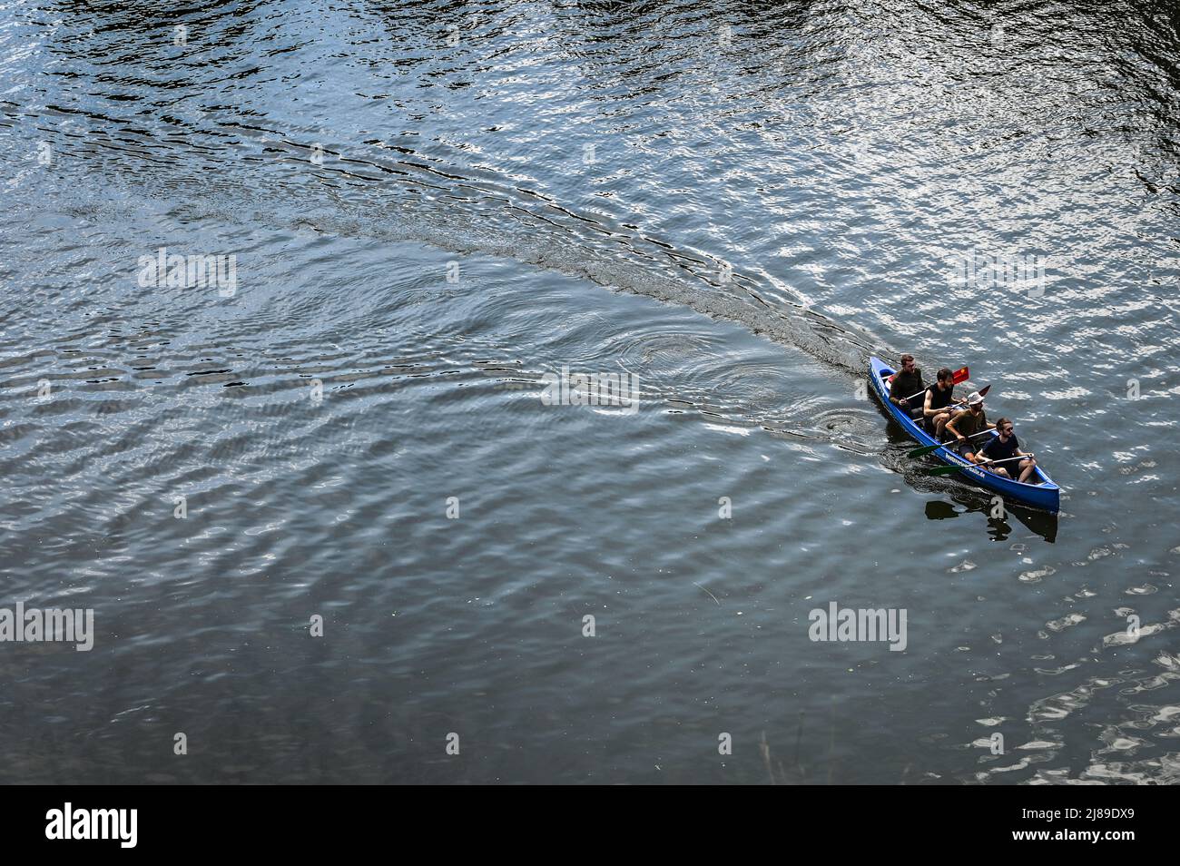 14 May 2022, Saxony-Anhalt, Halle (Saale): Canoeing on the river Saale ...