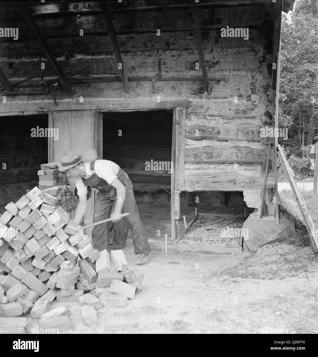 Male worker in orange Black and White Stock Photos & Images - Alamy