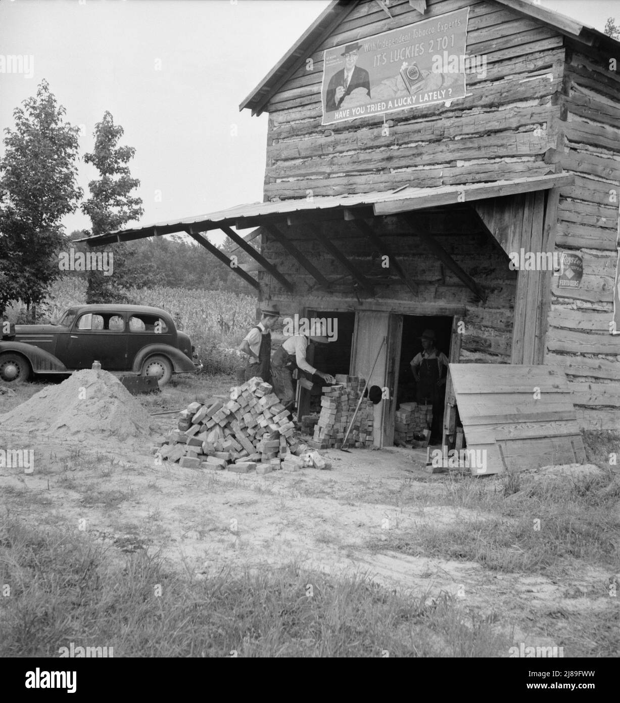 Male worker in orange Black and White Stock Photos & Images - Alamy