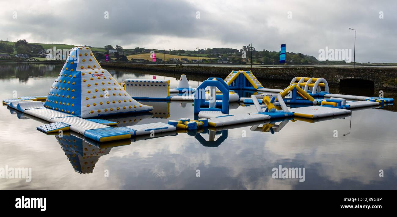 Floating activity centre reflecting in early morning still waters Stock ...